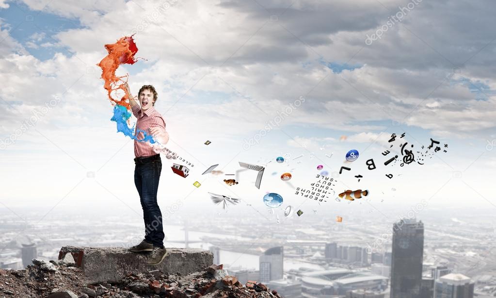 Man throwing paint splashes — Stock Photo © SergeyNivens #53046599