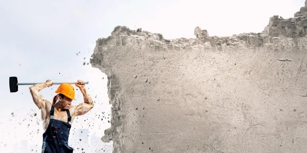 Man breaking wall Stock Photos, Royalty Free Man breaking wall Images ...