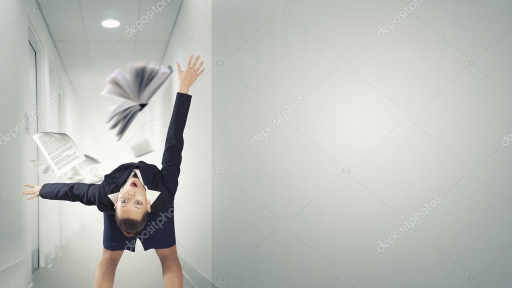 Woman evading flying book — Stock Photo © SergeyNivens #77421302