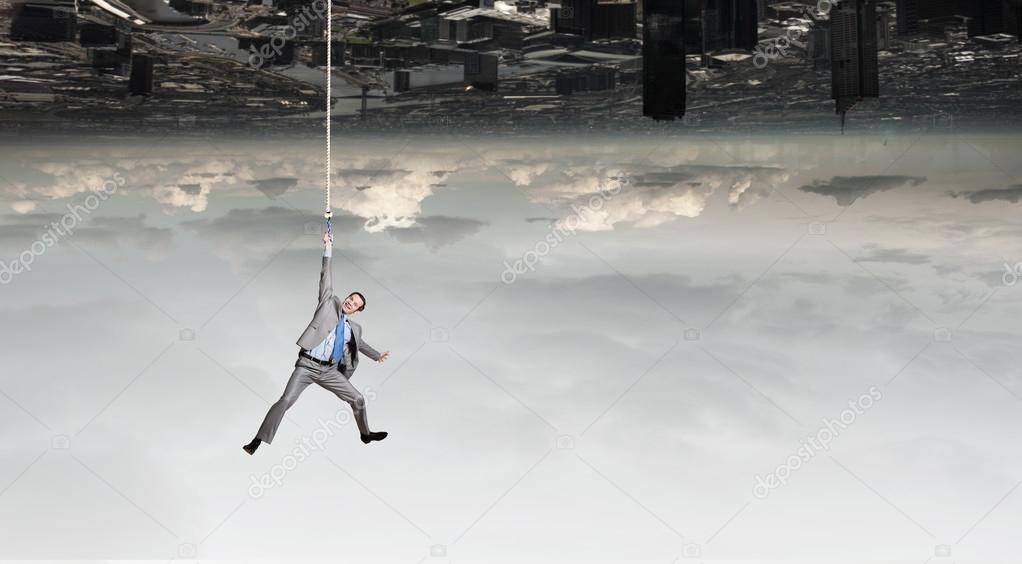 Man hang on rope — Stock Photo © SergeyNivens #77713944