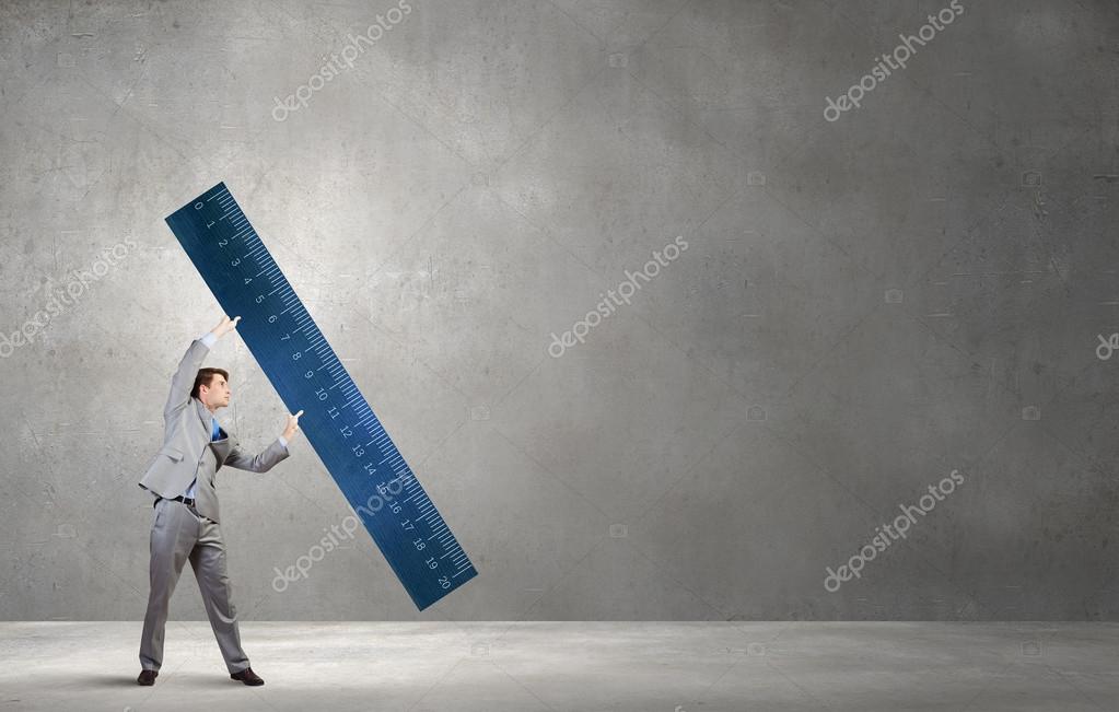 Man with scale Stock Photo by ©SergeyNivens 78379652