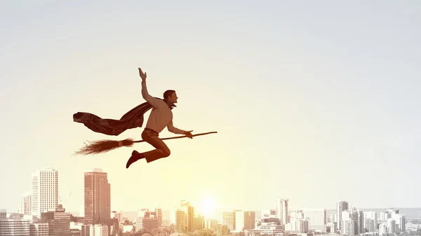 Man ride broom Stock Photo by ©SergeyNivens 79321258