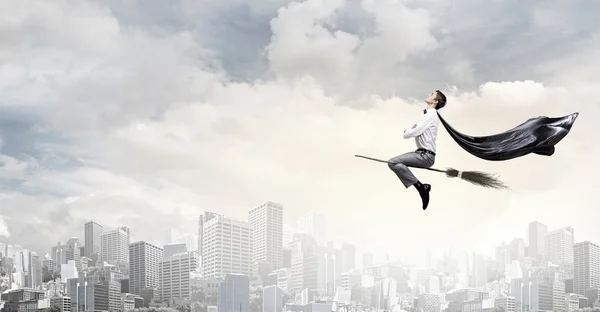 Man ride broom Stock Photo by ©SergeyNivens 79394782