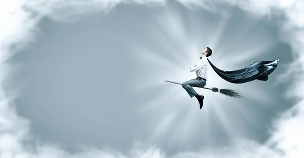 Man ride broom Stock Photo by ©SergeyNivens 79394782