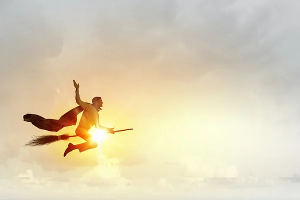 Man ride broom Stock Photo by ©SergeyNivens 79394782