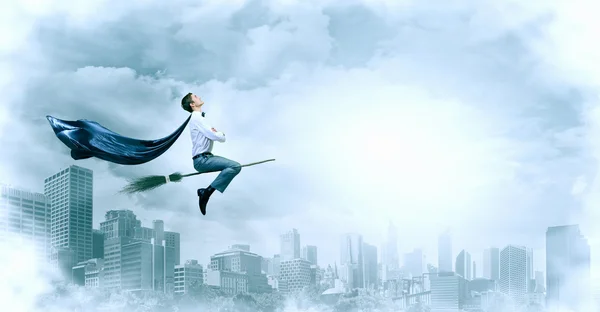 Man ride broom Stock Photo by ©SergeyNivens 79394782