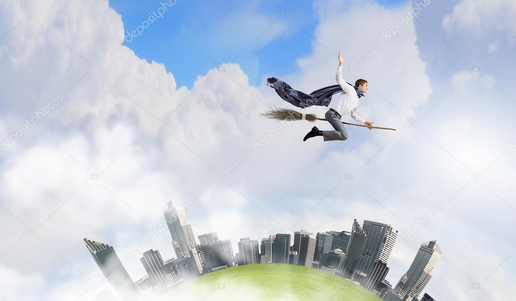 Man ride broom Stock Photo by ©SergeyNivens 79394782