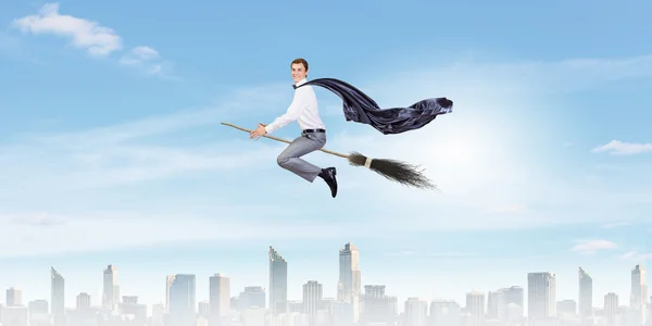 Man ride broom Stock Photo by ©SergeyNivens 79394782