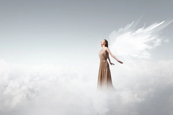 Angel girl flying high Stock Photo by ©SergeyNivens 92908658