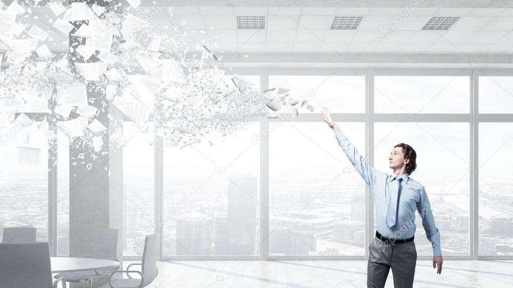 Businessman catching flying papers — Stock Photo © SergeyNivens #95085084