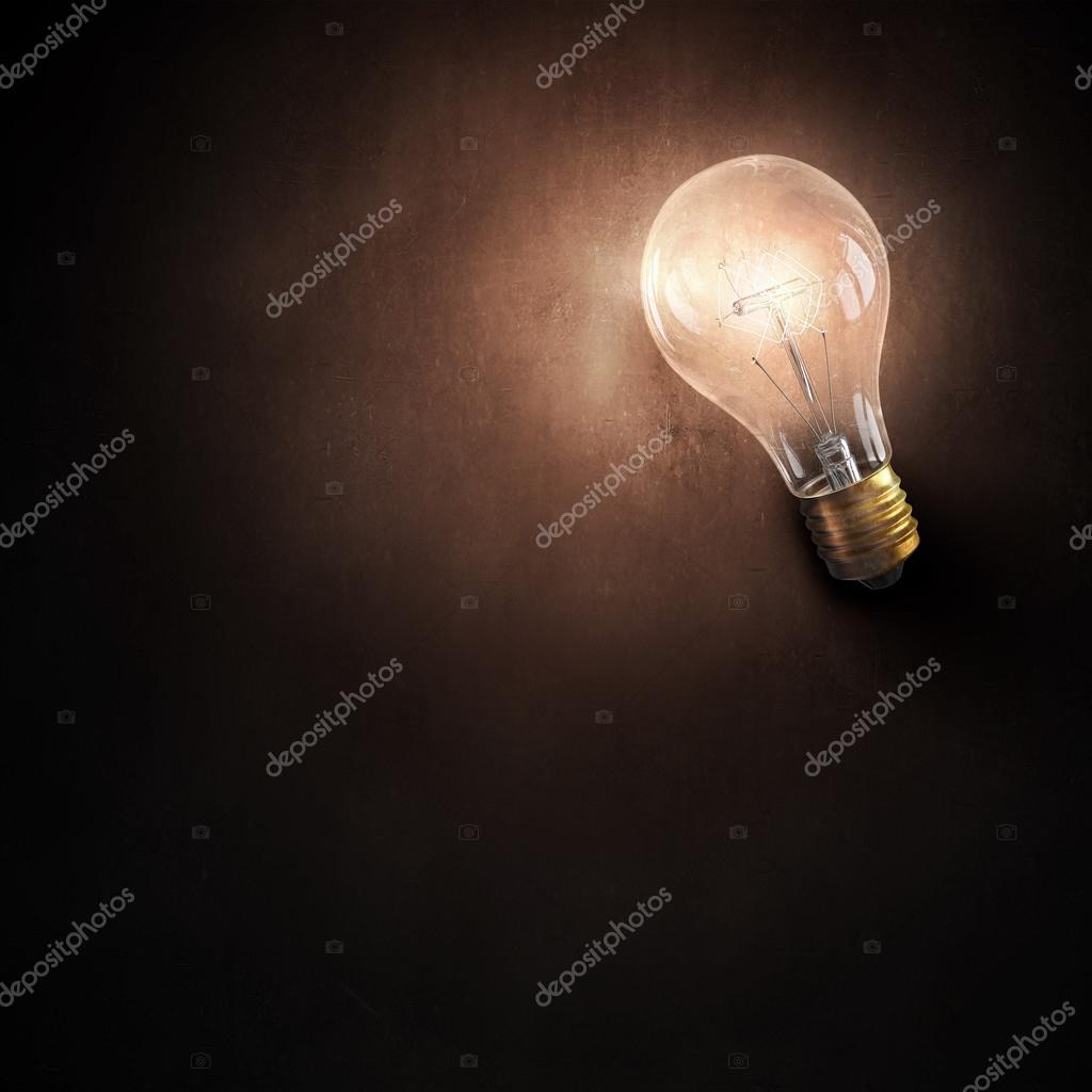 Light bulb on stone surface Stock Photo by ©SergeyNivens 97884104