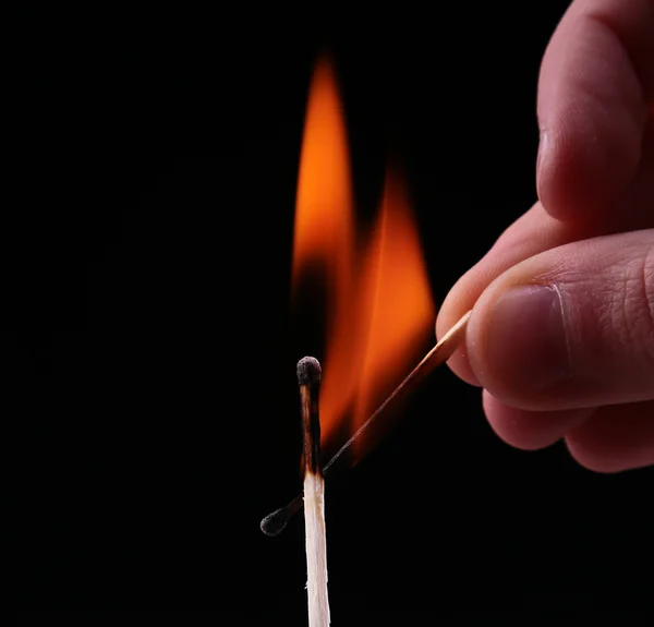 Ignition of a match, with smoke on dark background - Stock Image ...