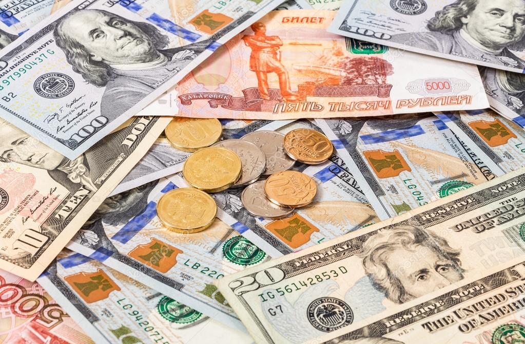 Russian rubles coins over dollars banknotes close up — Stock Photo ...
