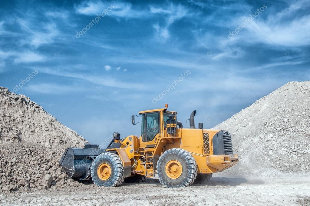 Excavator loader with backhoe works — Stock Photo © artfotoss #53977543