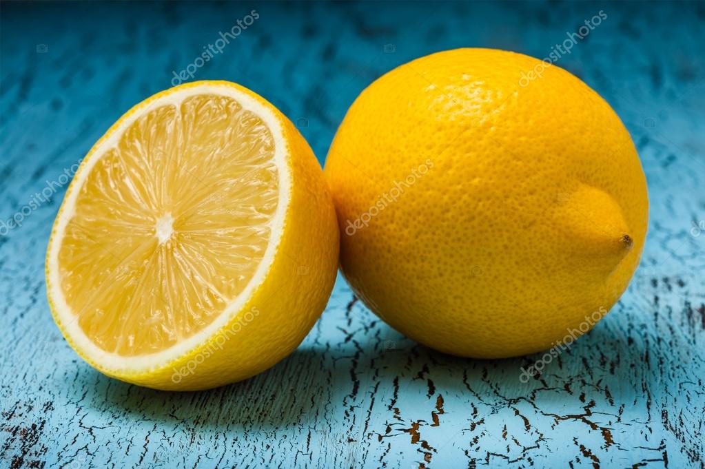 Lemon and cut half slice Stock Photo by ©DmitryRukhlenko 61588009