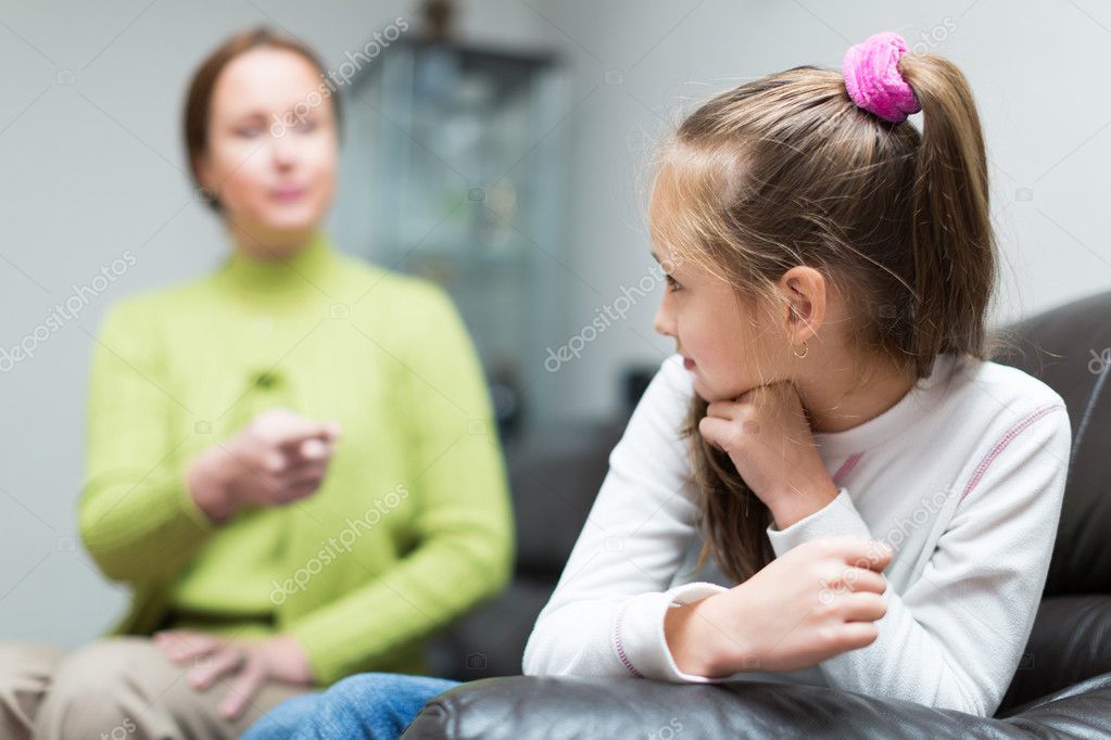 Woman berating daughter in home Stock Photo by ©Jim_Filim 64317811