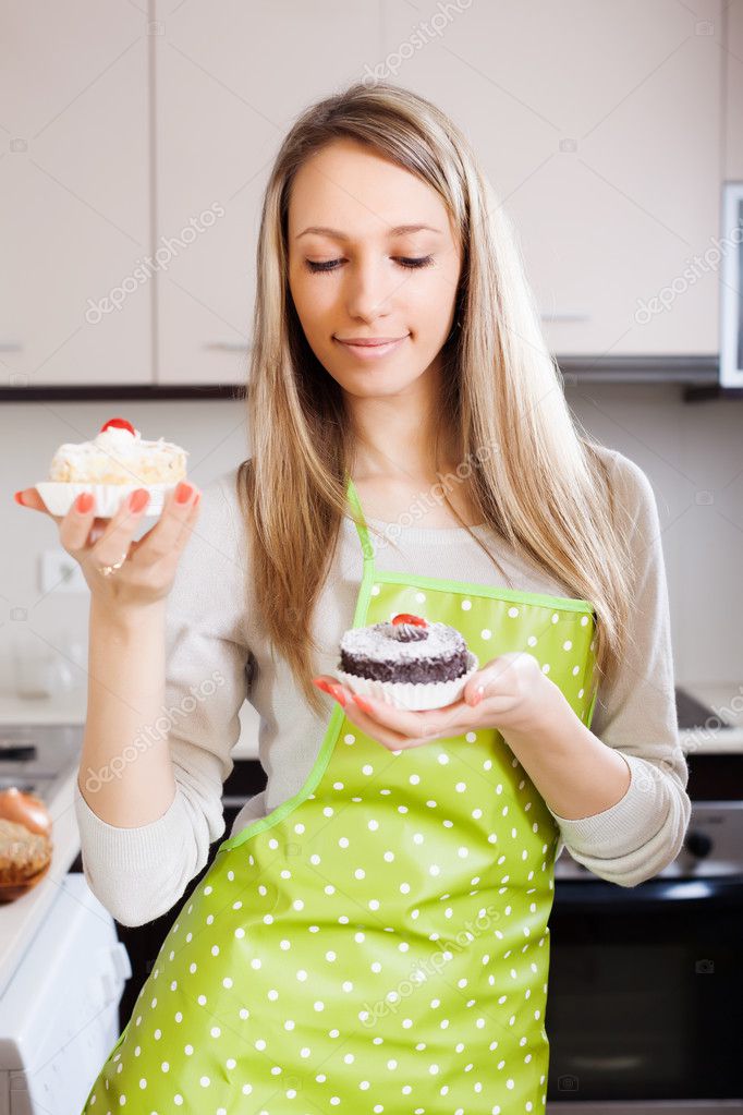Blonde girl with cakes — Stock Photo © Jim_Filim #66584957