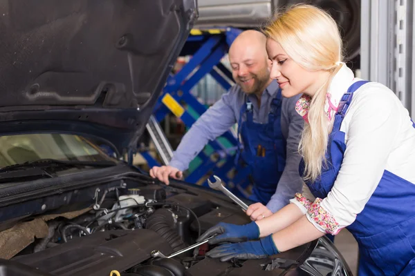 Auto service center crew near car - Stock Image - Everypixel