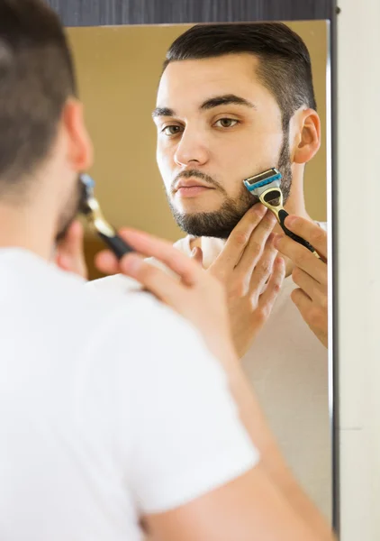 Man shaving face with razor - Stock Image - Everypixel