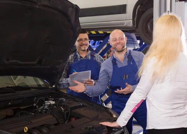 Service crew and woman driver - Stock Image - Everypixel