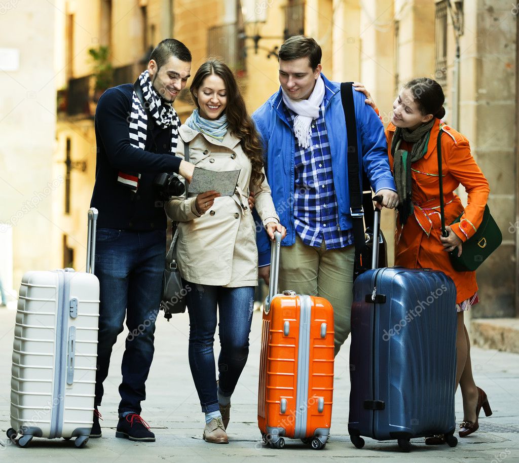 Two couples reading city map — Stock Photo © Jim_Filim #94874580
