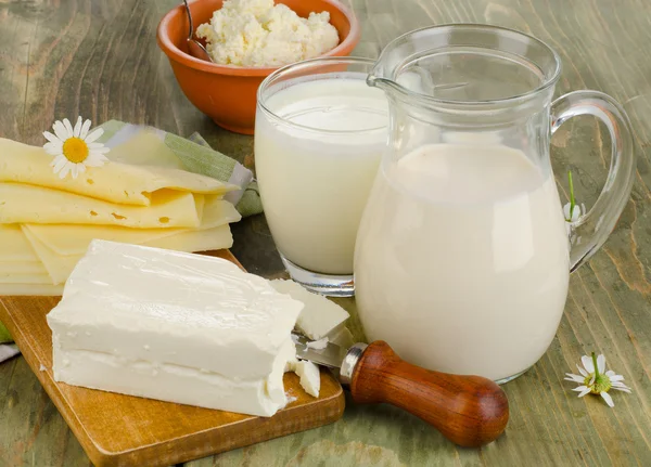 Set of fresh dairy products on wooden table, on white background Stock ...