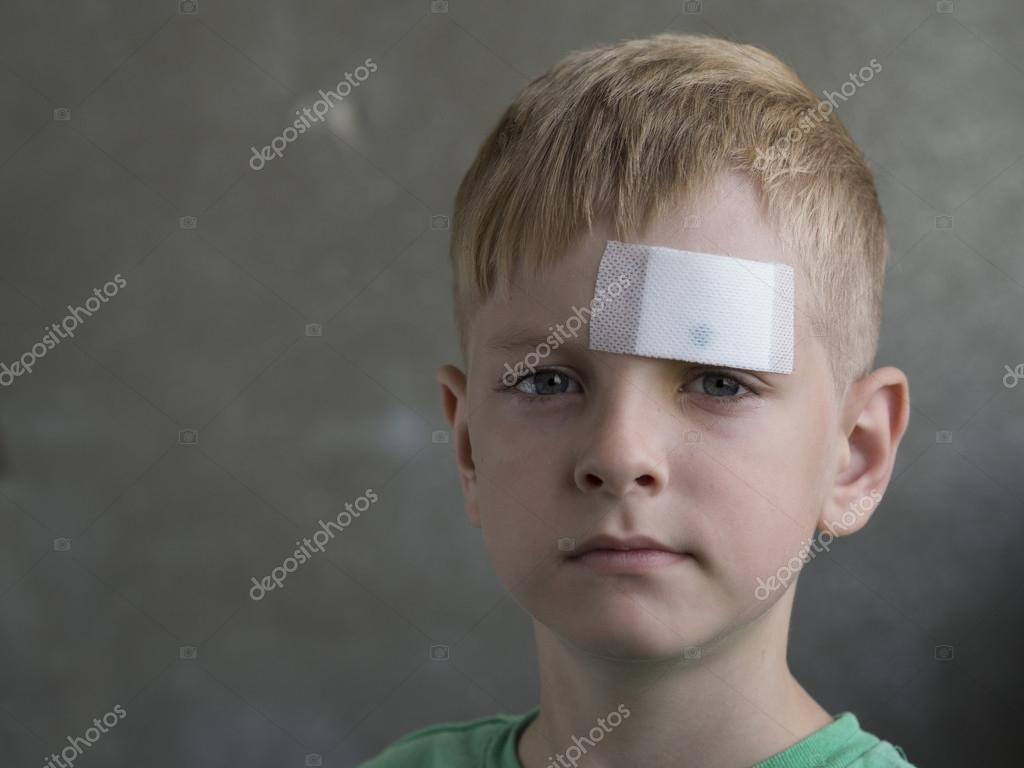 Boy with a plaster Stock Photo by ©igorgolovniov 122264066