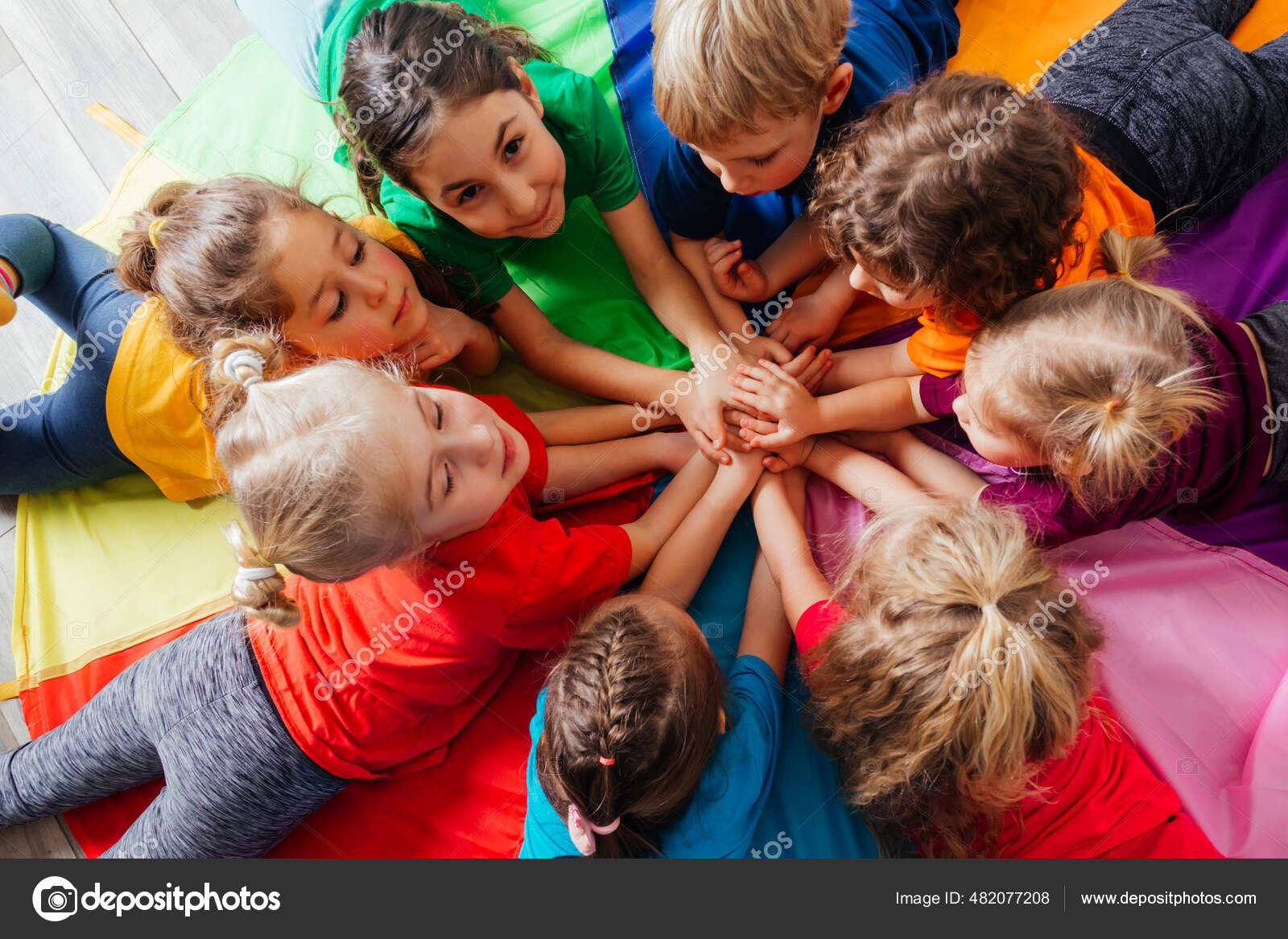 Team Huddle Hands Up Girls
