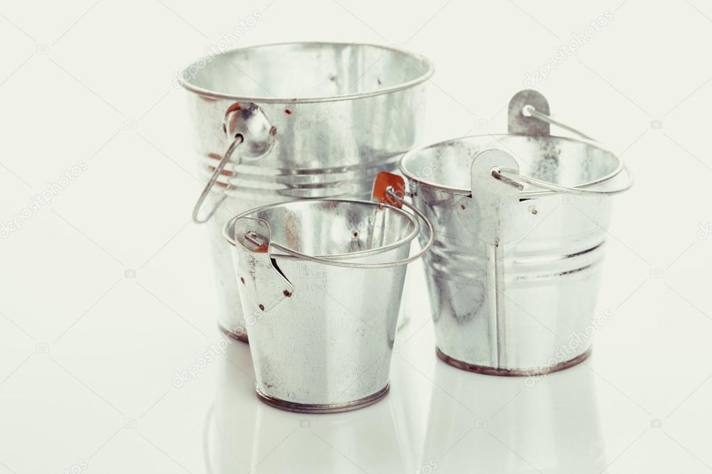 Three metal buckets Stock Photo by ©oksixx 92577430