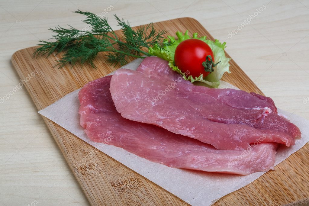 Raw pork schnitzel Stock Photo by ©AndreySt 81923176