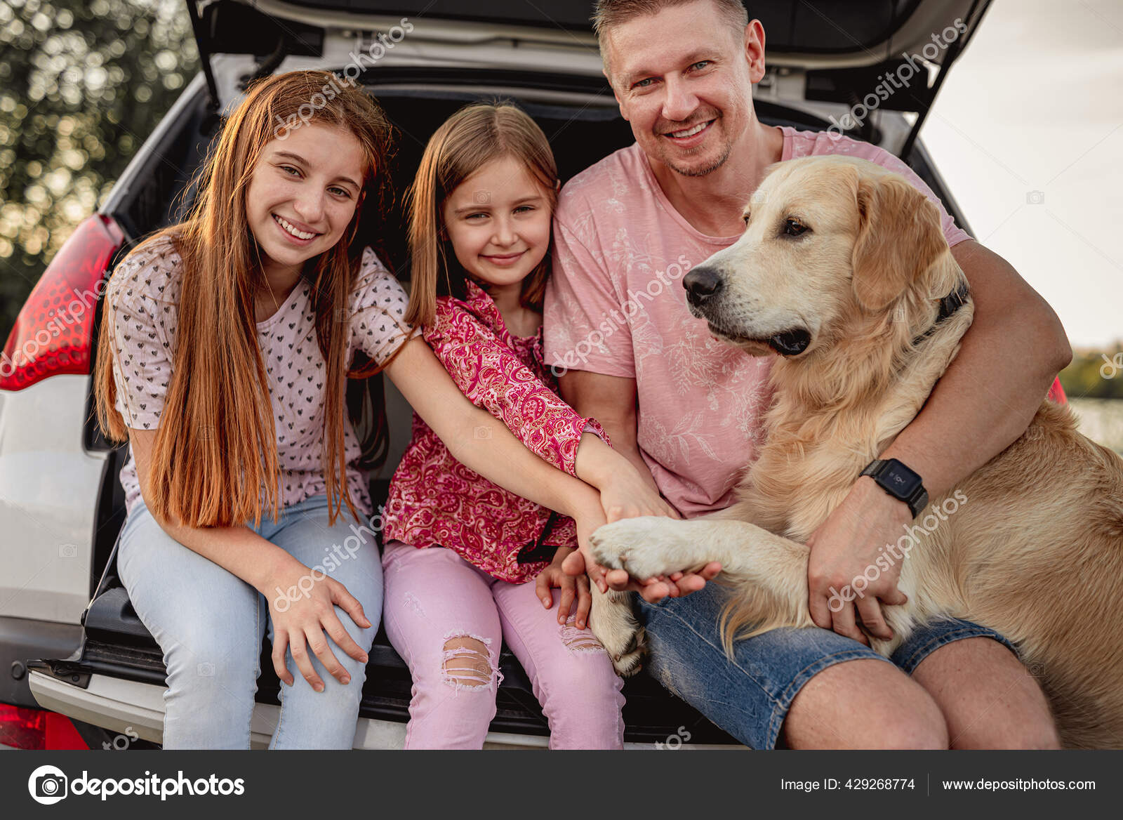 Father with daughters and golden retriever — Stock Photo © tan4ikk #429268774