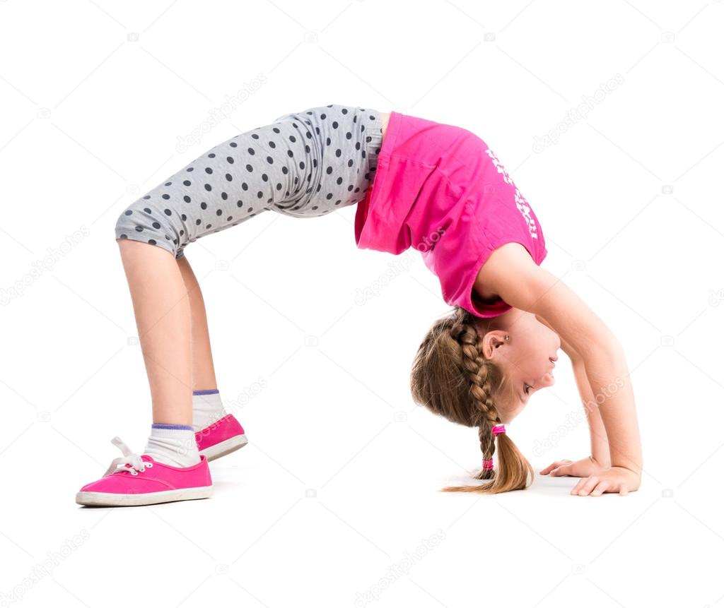 Little girl doing the bridge exercise Stock Photo by ©tan4ikk 82449384