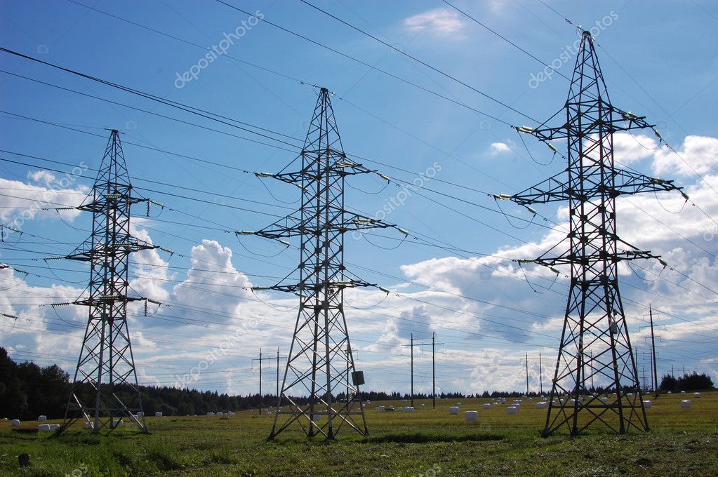 High voltage power lines above wheat field, Electric power station in ...