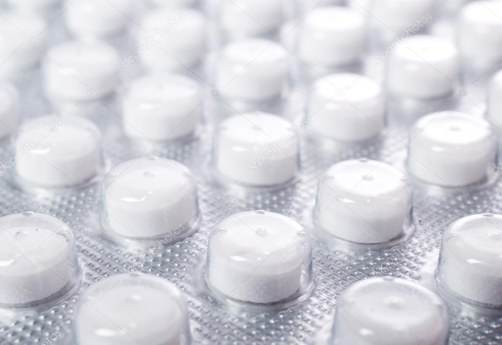 White tablets closeup background. Stock Photo by ©Leonardi 101774576