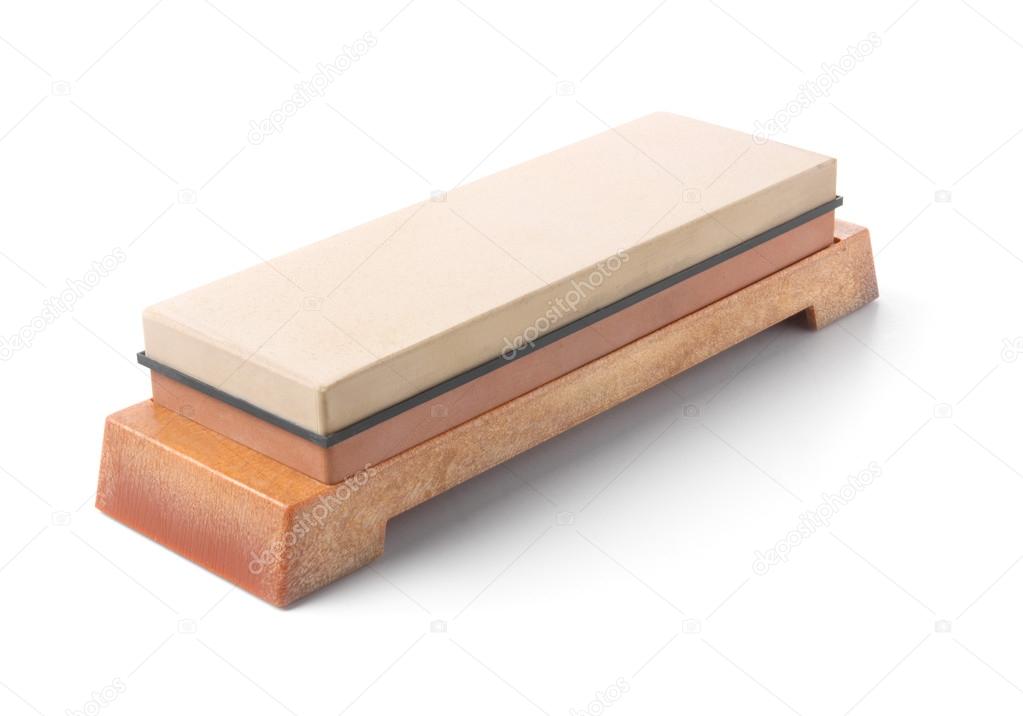 Japanese grinding stone on rest. Isolated on white. — Stock Photo ...