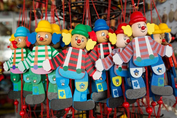 Wooden clowns puppet dolls Stock Photo by ©gerasimov 60730081