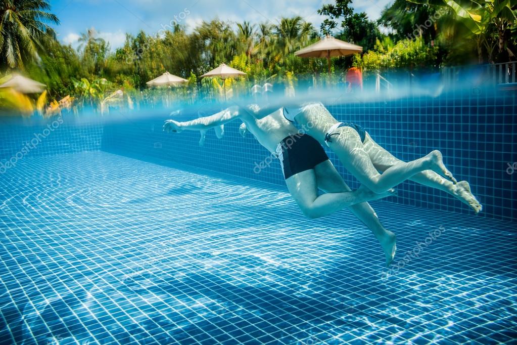 Couple floating in the pool on holiday — Stock Photo © cookelma #65048983