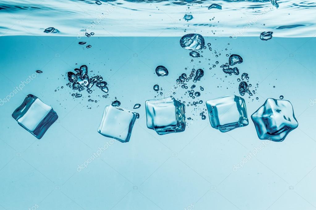 Ice cubes falling under water — Stock Photo © cookelma #95175008