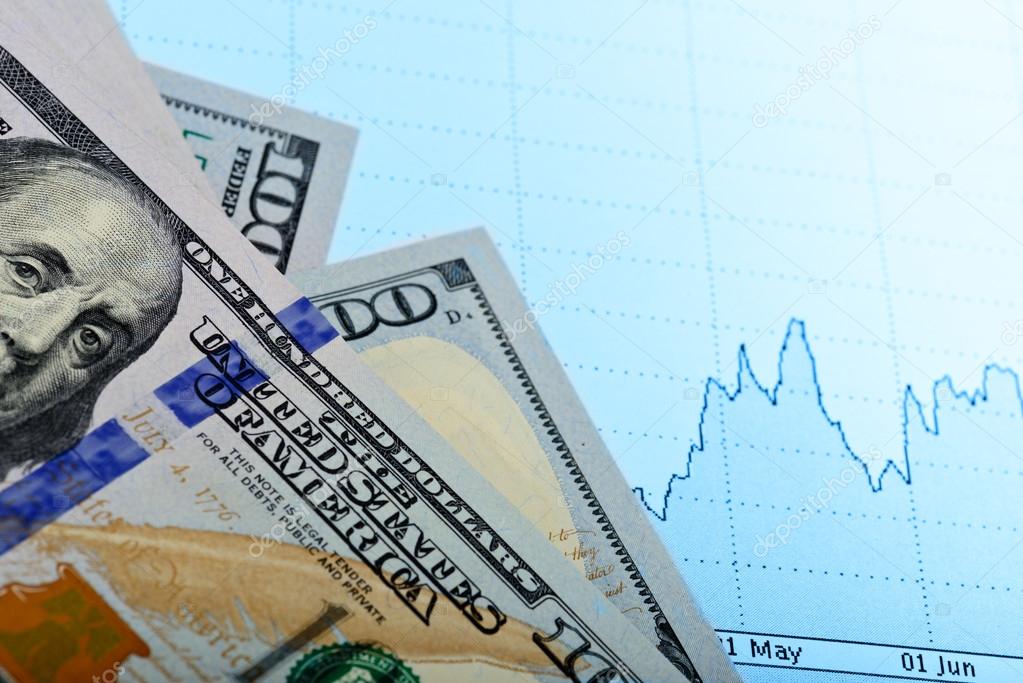 Banknotes and financial charts Stock Photo by ©Paulpaladin 80185478