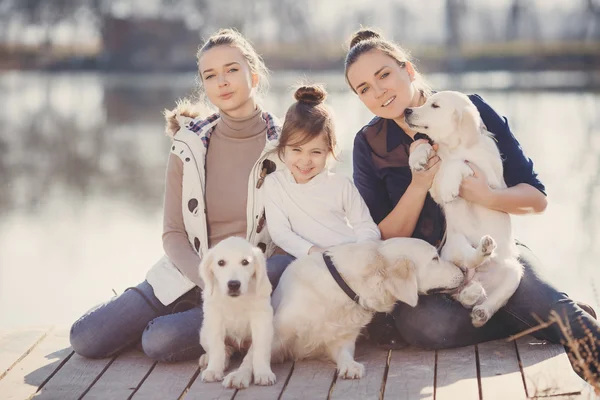 Happy family with Pets near the lake - Stock Image - Everypixel