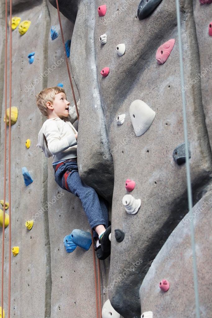 Kid rock climbing — Stock Photo © noblige #95319850