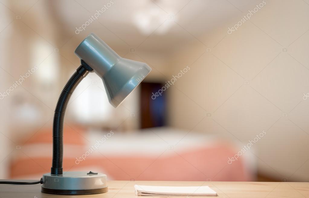 Lamp and notebook on table — Stock Photo © avlntn #98863690