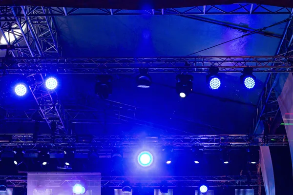 spotlights on stage during the rain - Stock Image - Everypixel