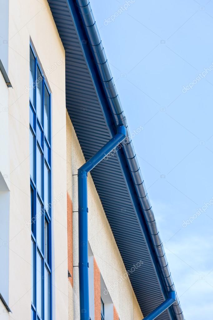 Newly installed blue rain gutter and drainpipe — Stock Photo ...