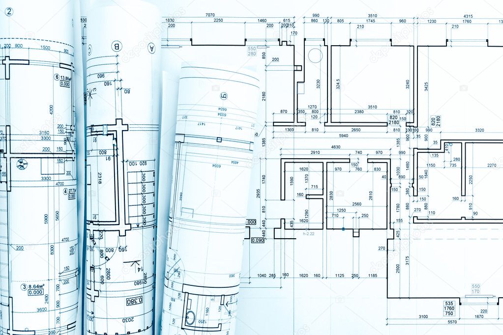 Blueprint rolls and technical drawings on architect work table — Stock ...
