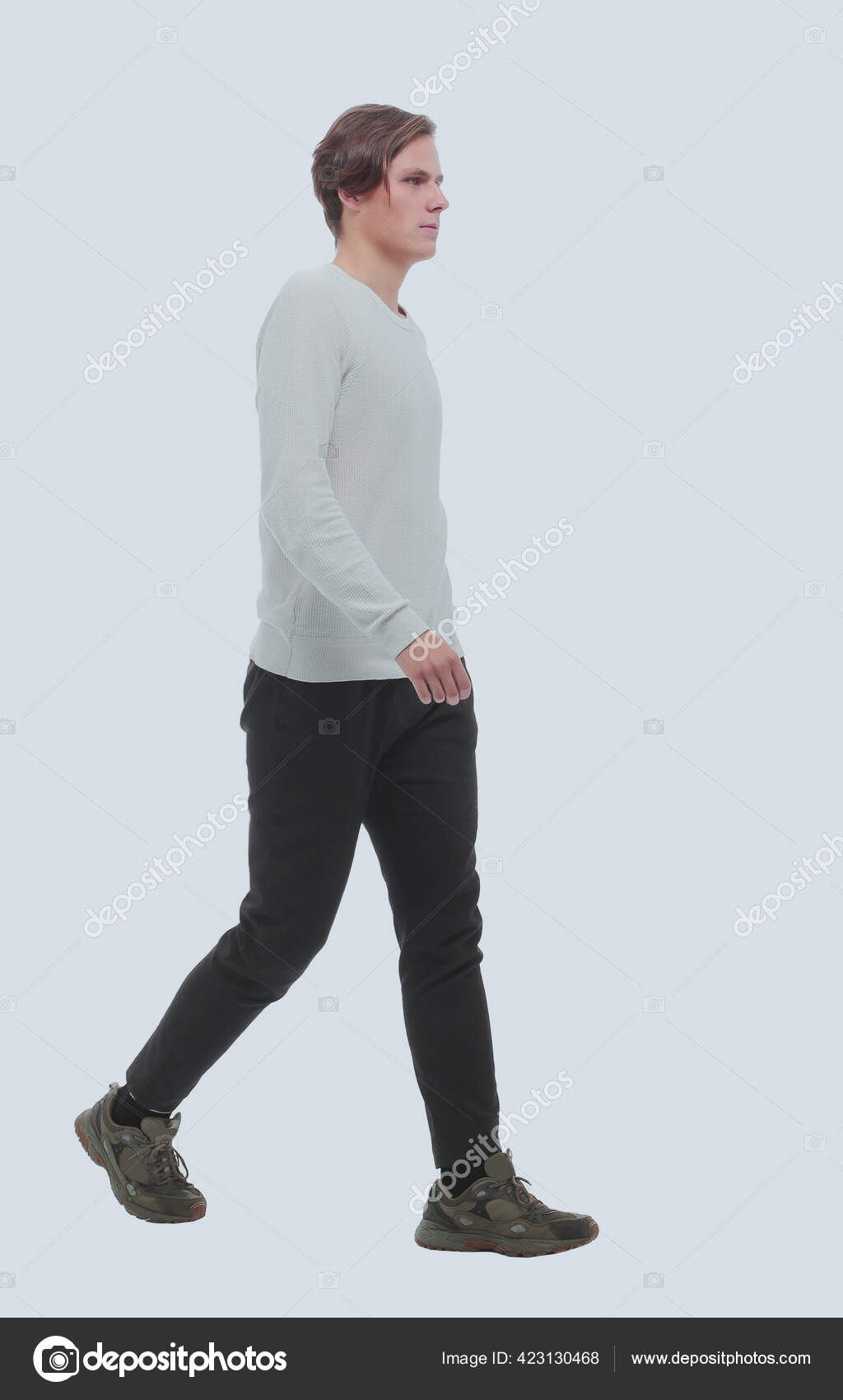 In full growth. confident young man striding forward. — Stock Photo ...