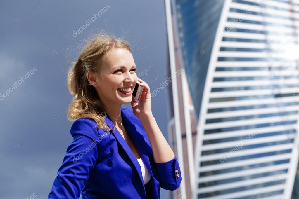 Beautiful young blonde calling by phone – Stock Editorial Photo ...