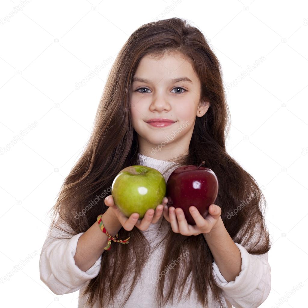 Little girl holding two apples Stock Photo by ©arkusha 64650811