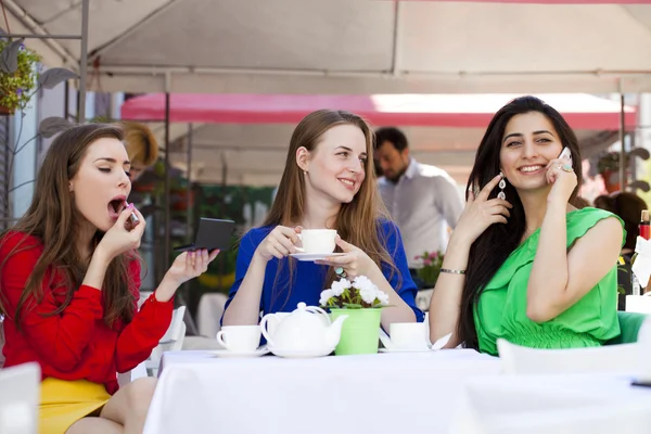 Three happy beautiful girls girlfriend drinking tea in a summer - Stock ...