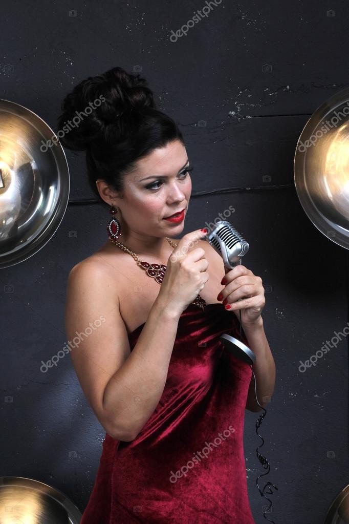 Singer on stage with spotlight — Stock Photo © gsdonlin #75673319